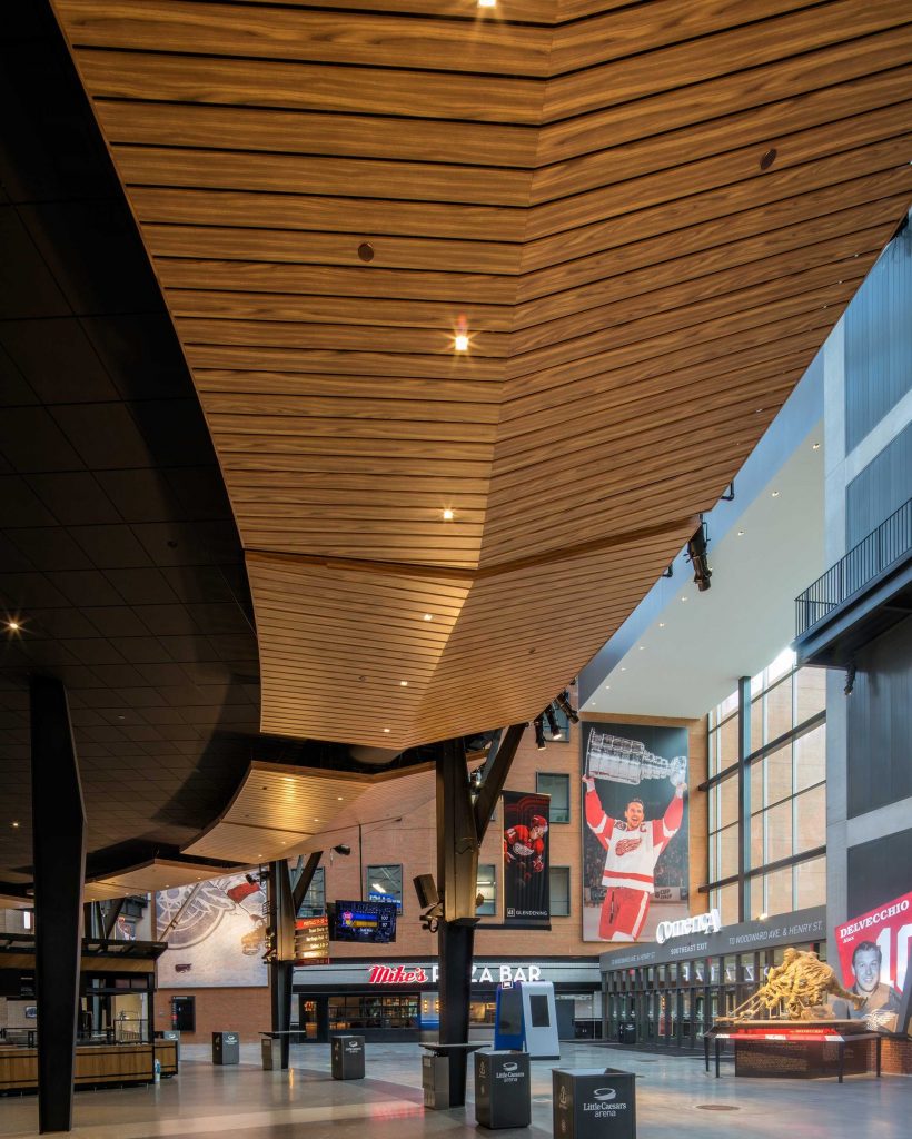 Linear ceiling panels join together to form an inverted “v” peak that ...